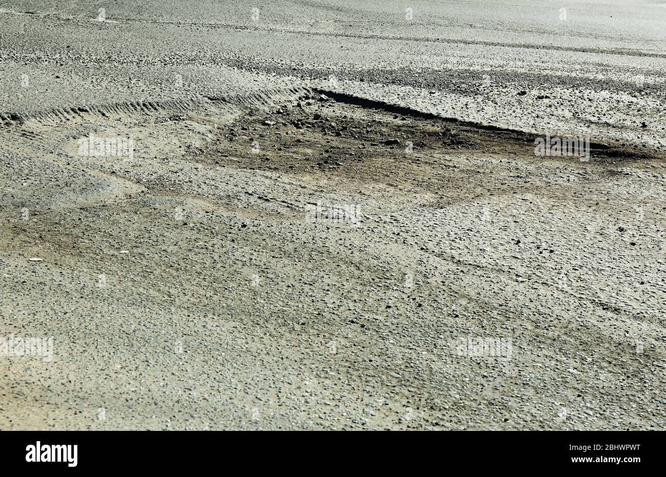 Very bad quality road with potholes Stock Photo - Alamy