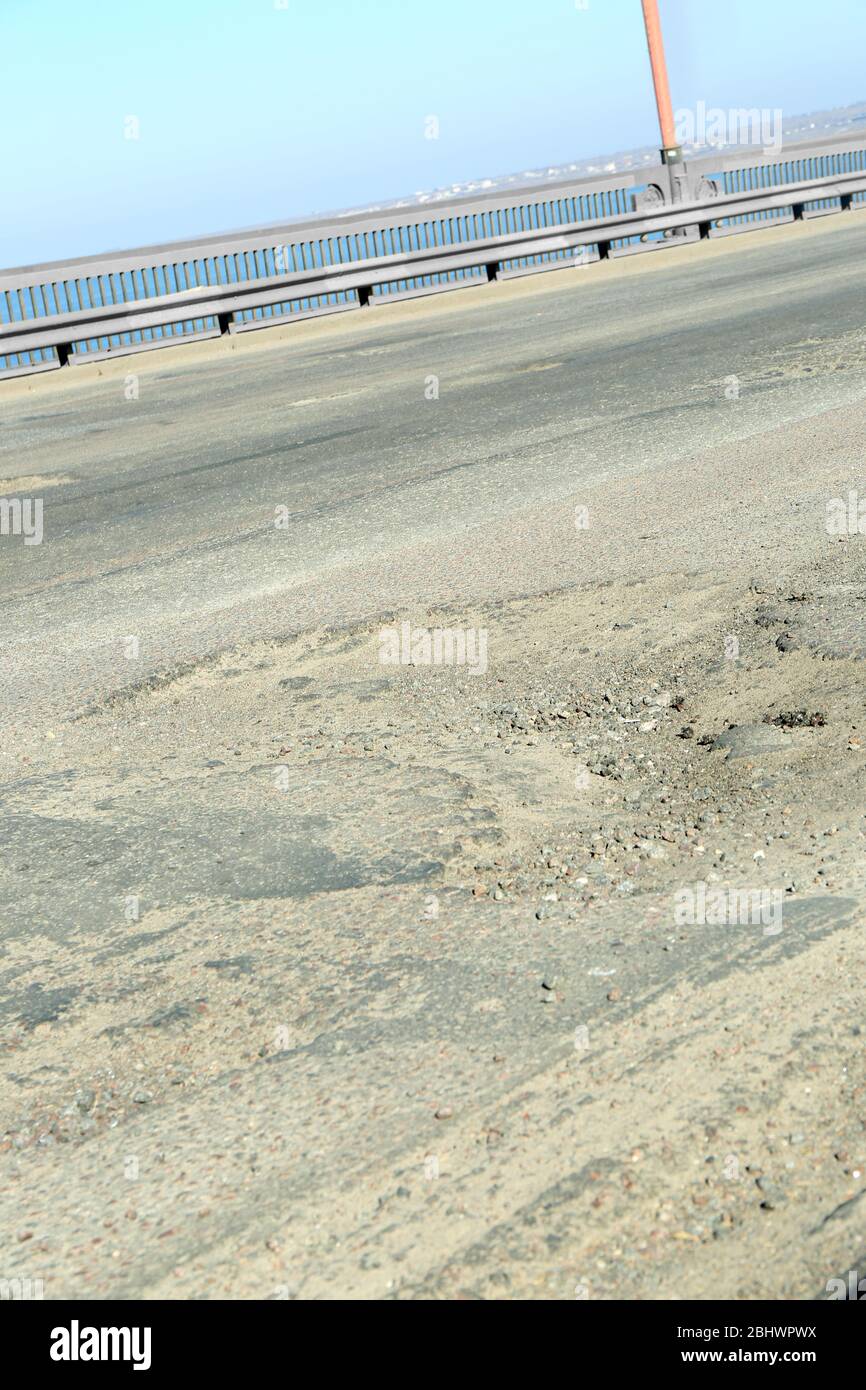 Very bad quality road with potholes Stock Photo - Alamy