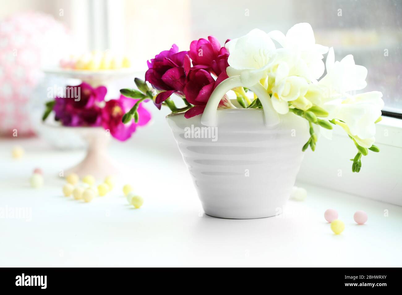 Beautiful spring flowers on windowsill background Stock Photo - Alamy