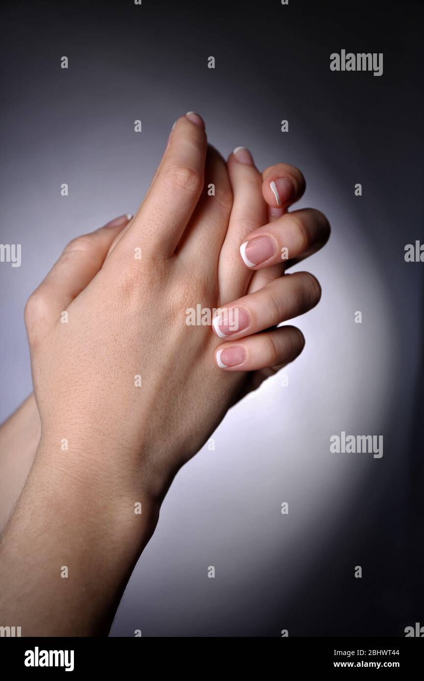 Woman praying on bright background Stock Photo - Alamy