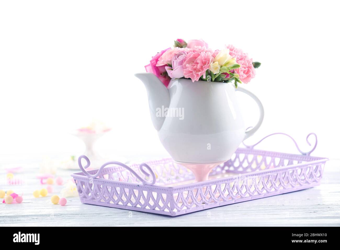 Beautiful spring flowers in teapot isolated on white Stock Photo - Alamy
