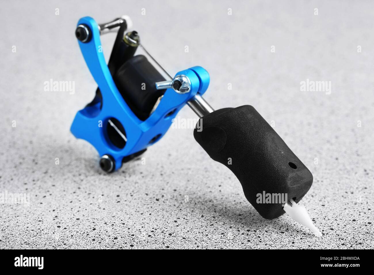 Machine for tattoo, on grey background Stock Photo - Alamy