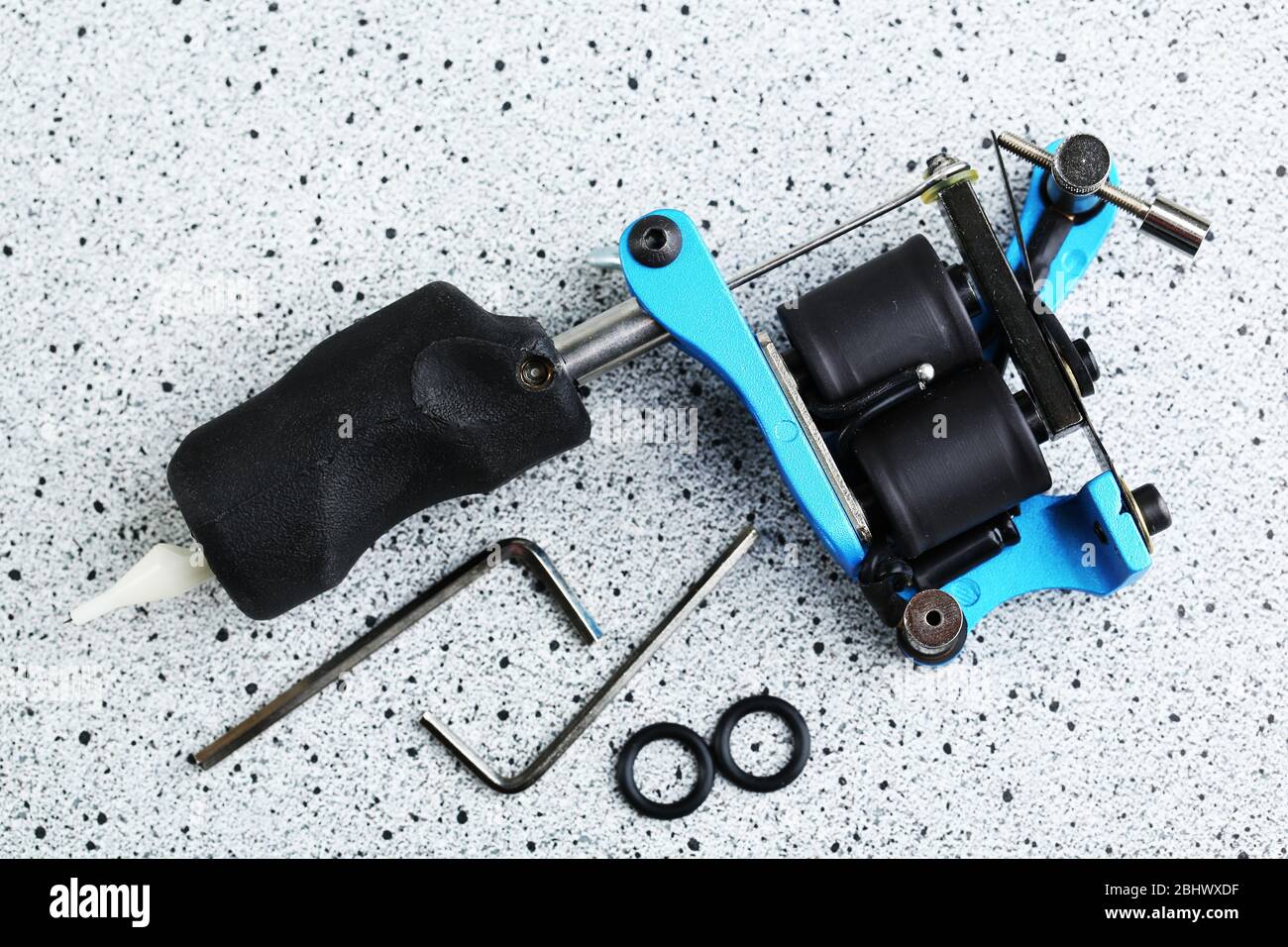 Machine for tattoo, on grey background Stock Photo - Alamy