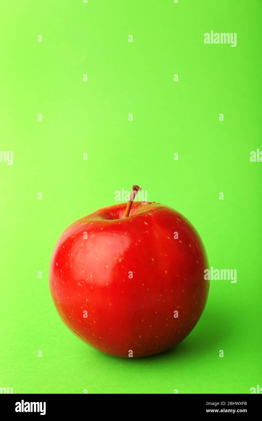 Apple on color background Stock Photo - Alamy