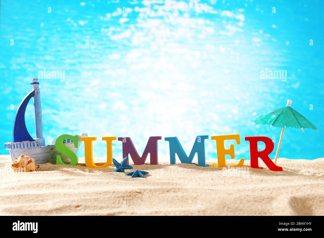 Word summer on beach sand Stock Photo - Alamy
