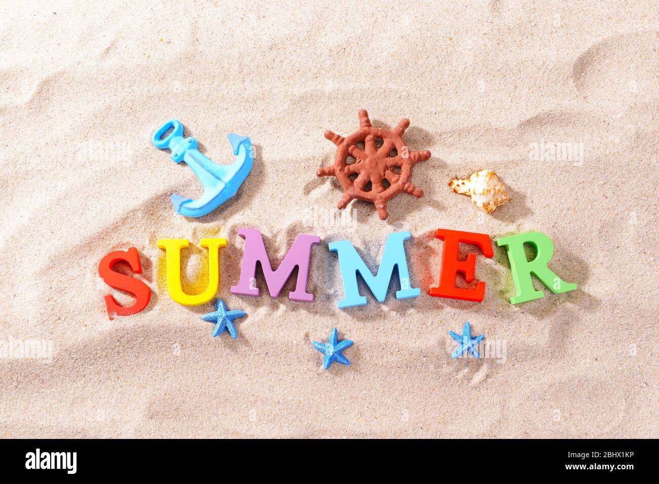 Word summer on beach background Stock Photo - Alamy