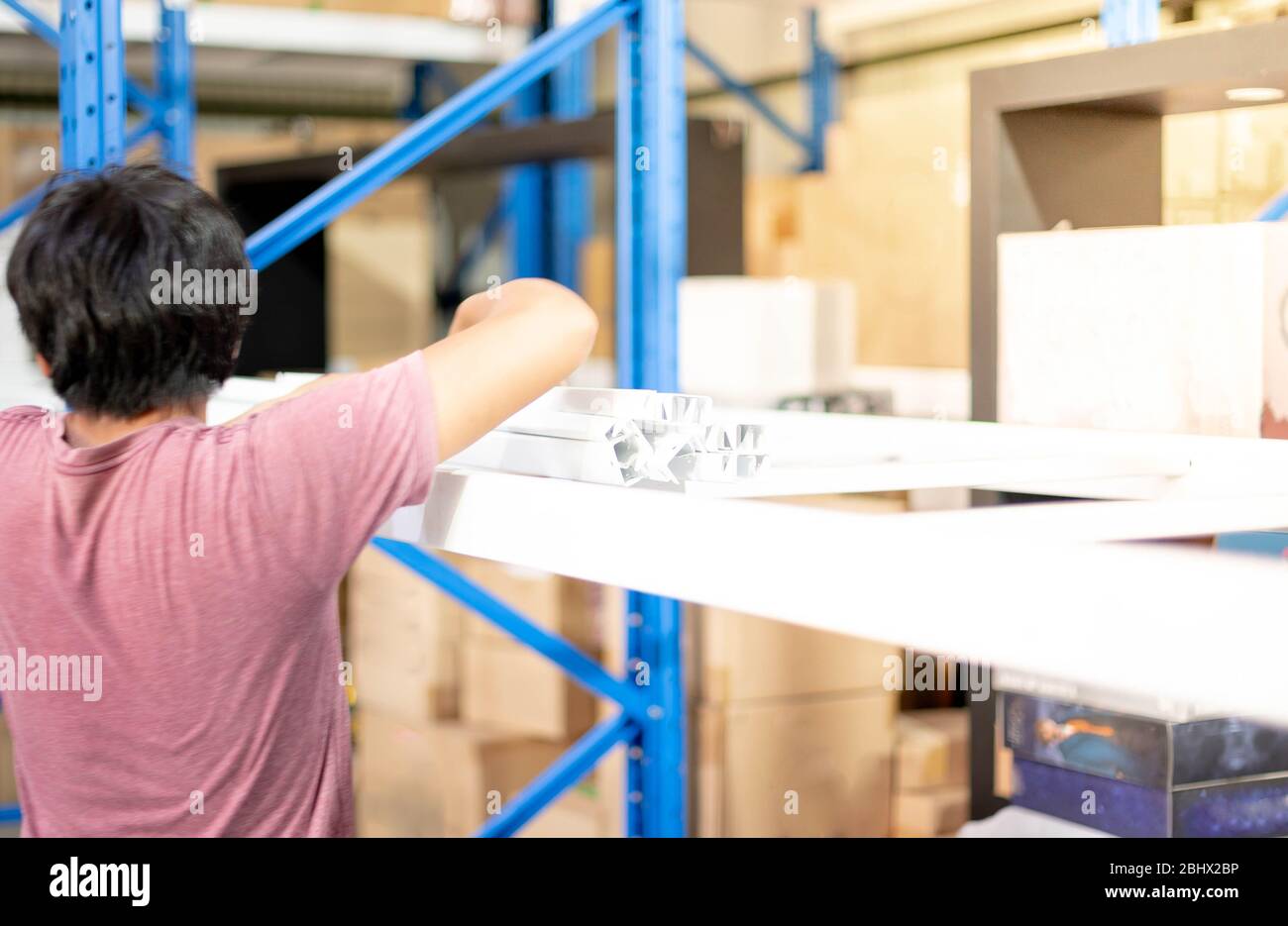 Male hand holding prepare to assembling the metal rack in warehouse or ...