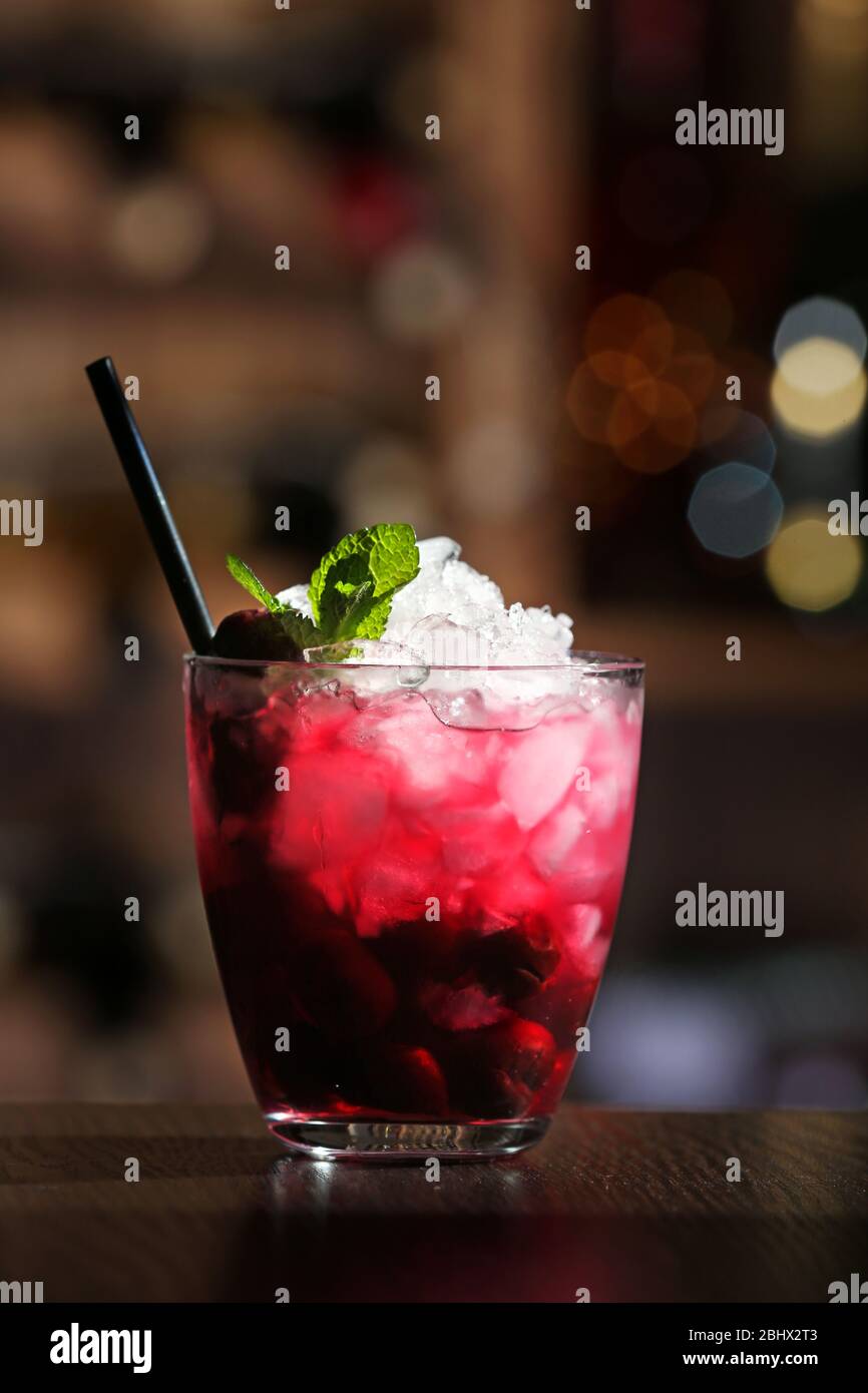 Glass of cocktail on bar background Stock Photo - Alamy
