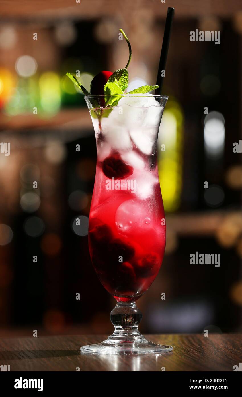 Glass of cocktail on bar background Stock Photo - Alamy