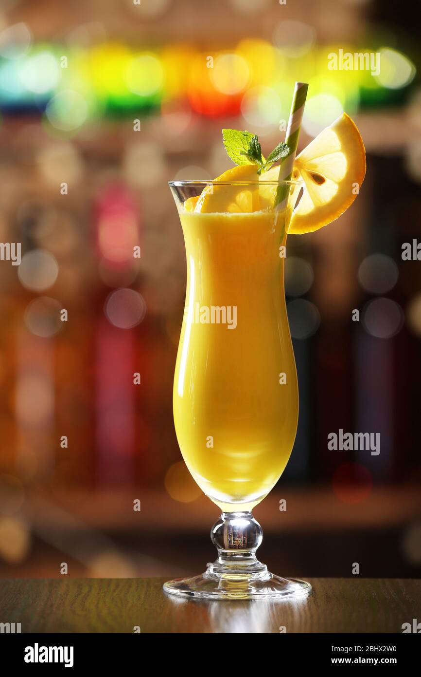 Glass of cocktail on bar background Stock Photo - Alamy