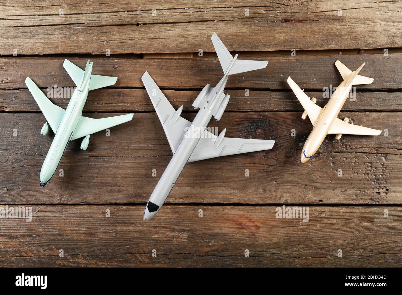 Models of airplane on wooden background Stock Photo - Alamy
