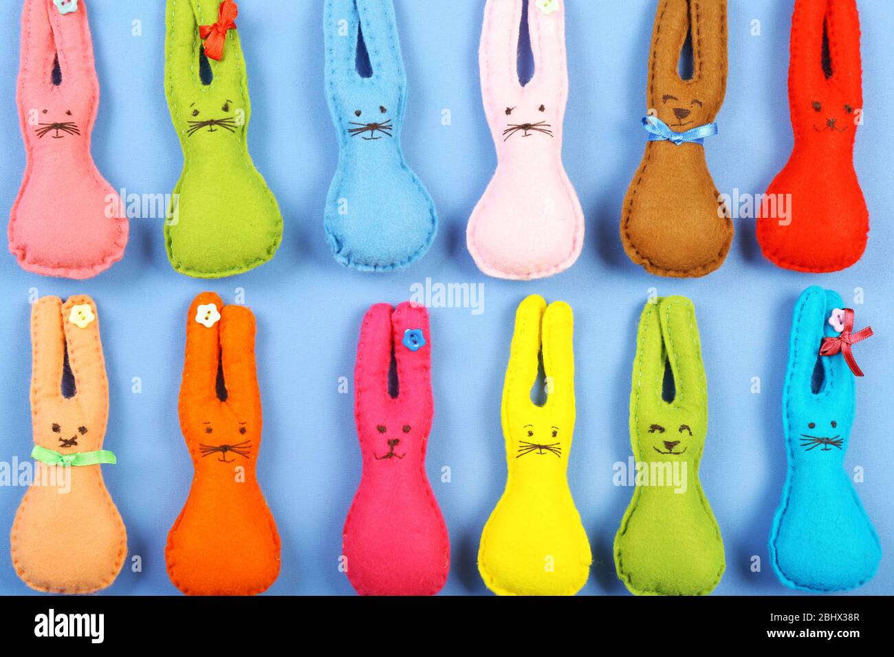 Handmade Easter rabbits on color table, top view Stock Photo - Alamy