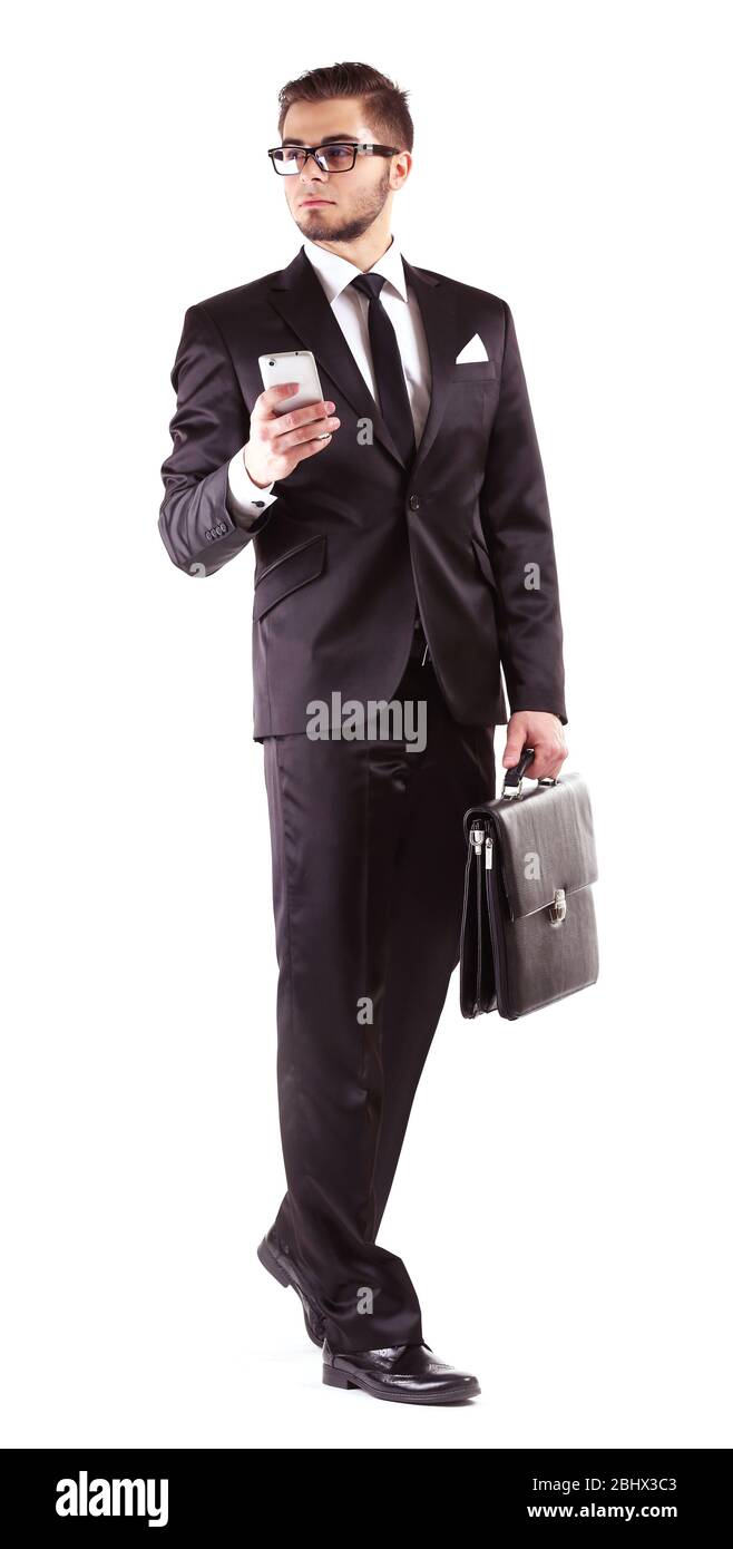 Elegant man in suit with mobile phone and briefcase isolated on white ...
