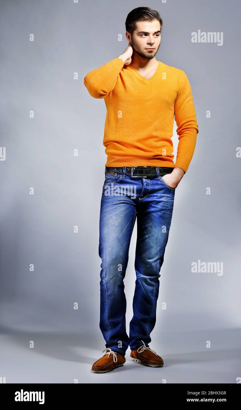 Portrait of young man on gray background Stock Photo - Alamy