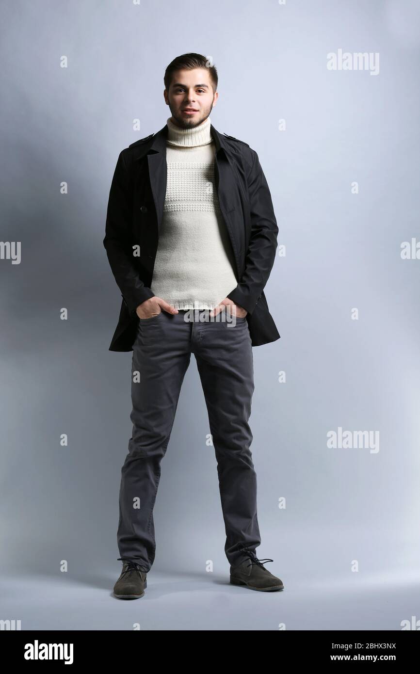 Elegant man on gray background Stock Photo - Alamy