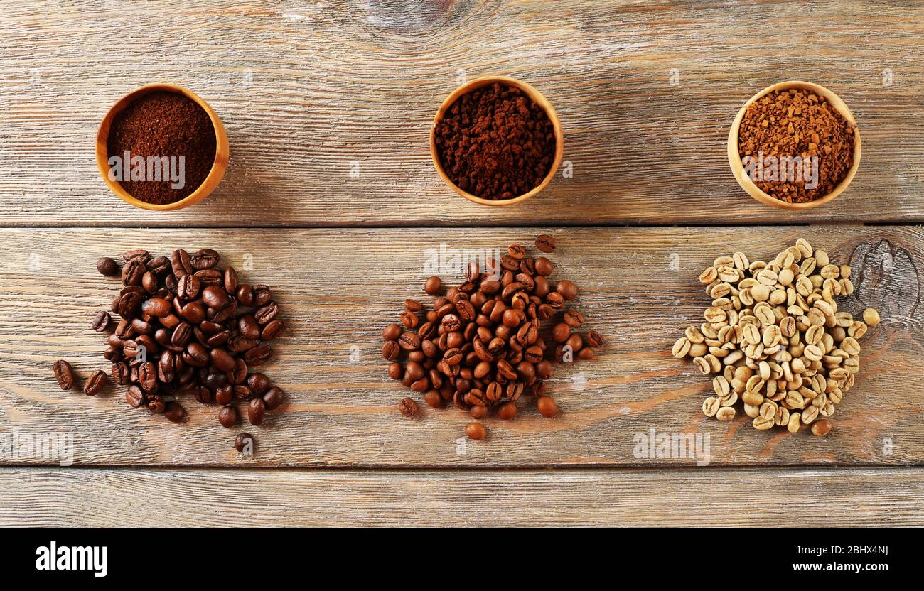 Various of coffee in small dishes on wooden table, top view Stock Photo ...