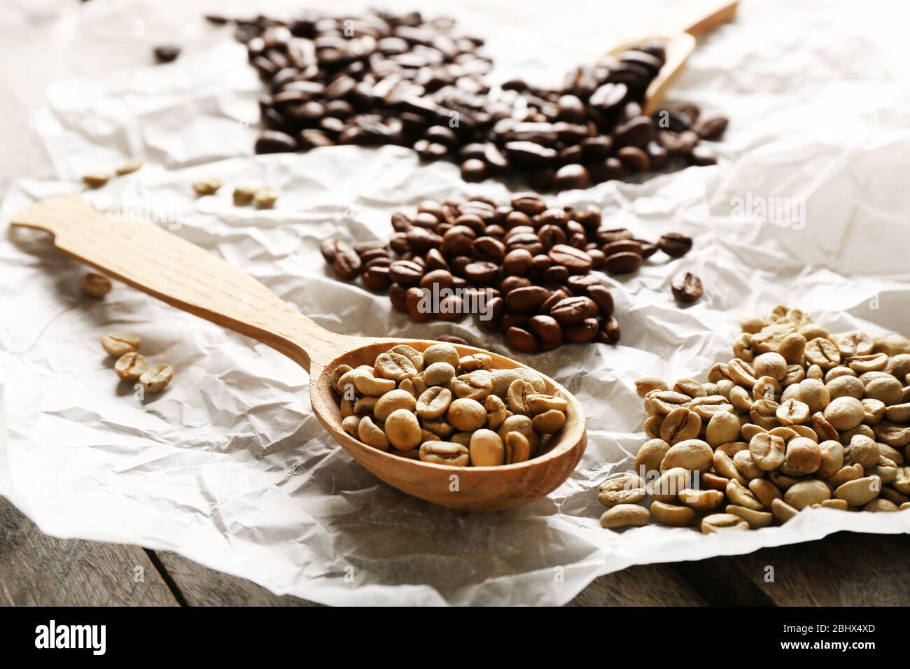 Coffee beans on crumpled parchment, closeup Stock Photo - Alamy