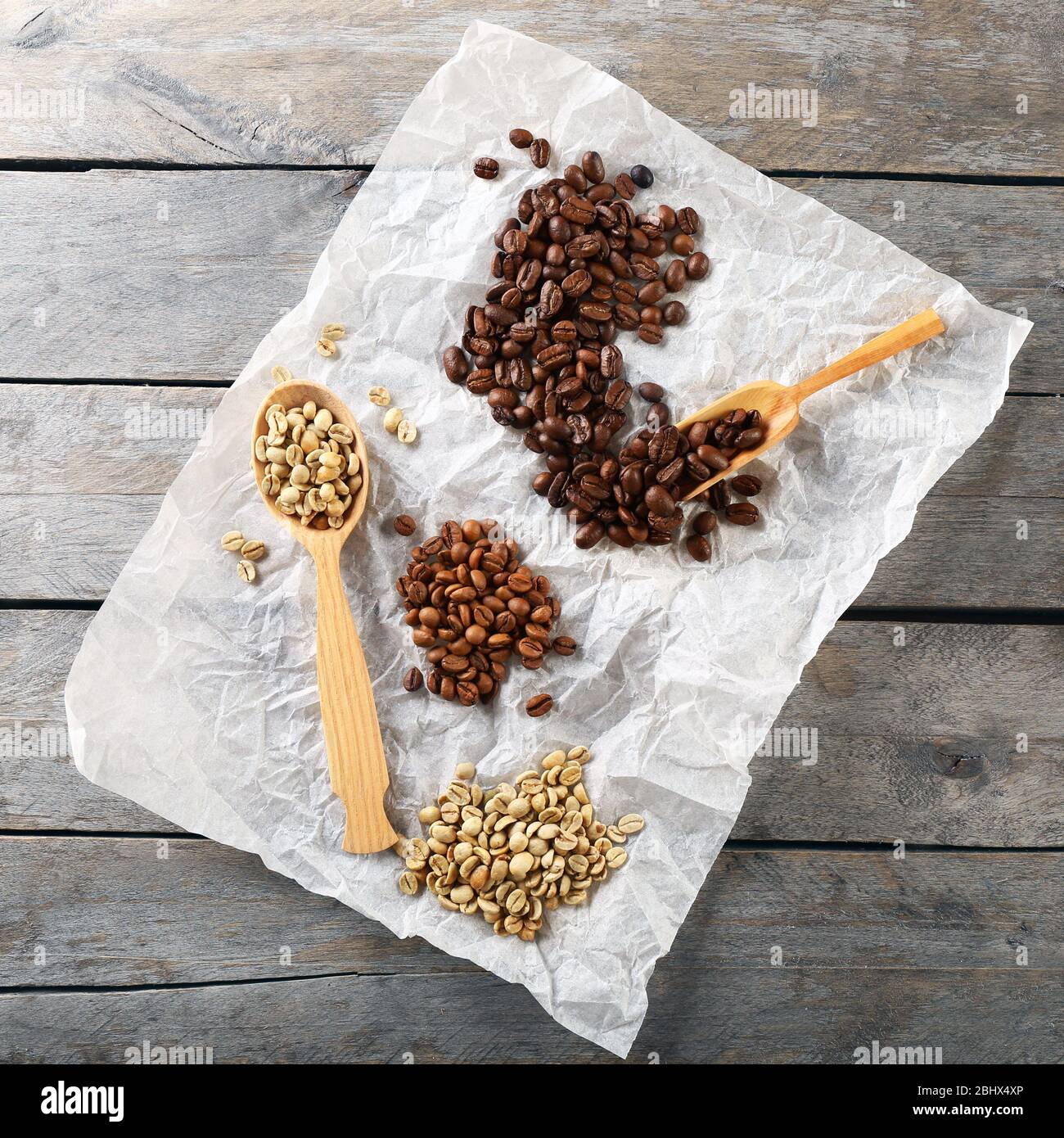 Coffee beans on crumpled parchment on wooden table, top view Stock ...