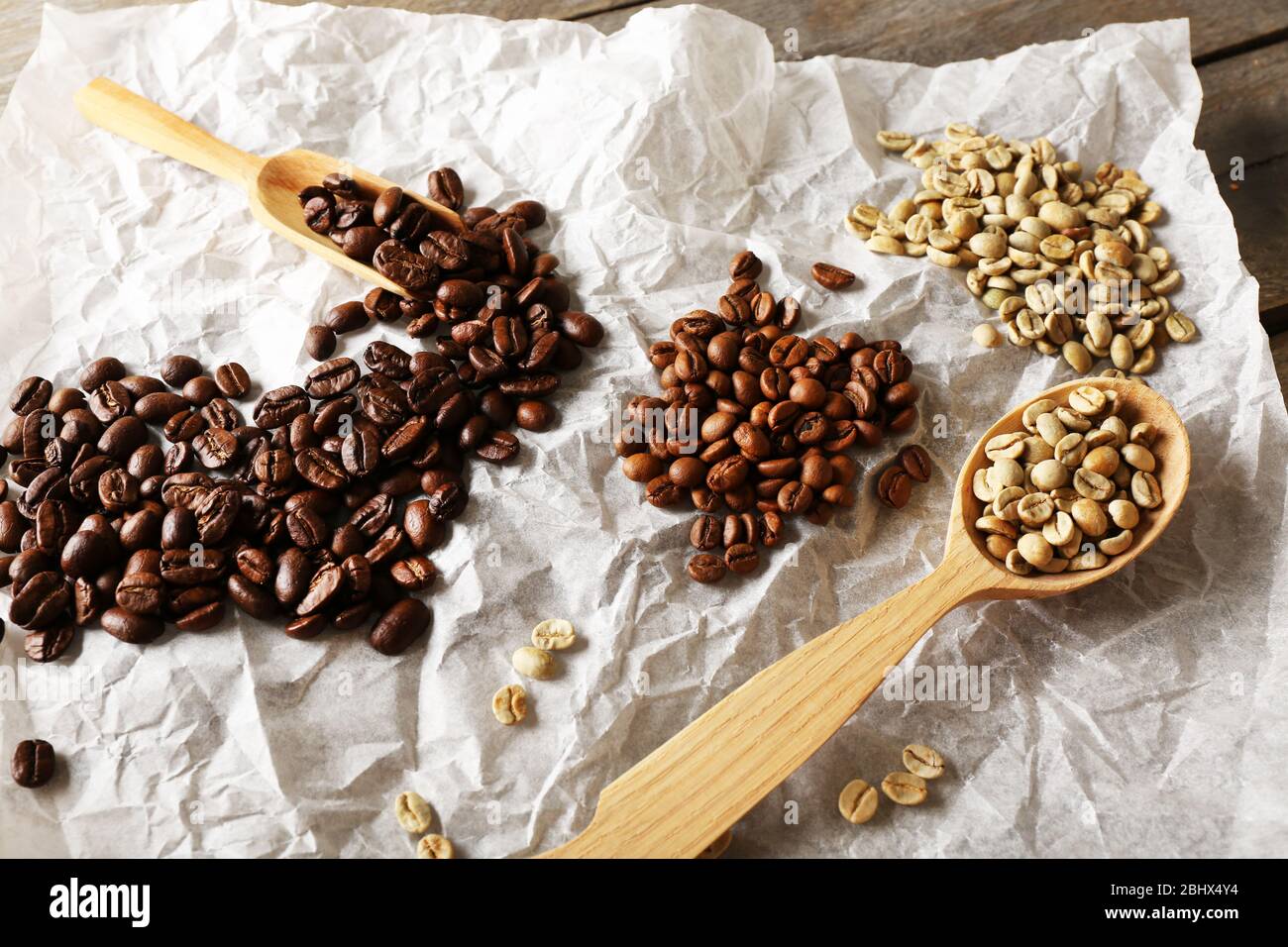 Coffee beans on crumpled parchment, closeup Stock Photo - Alamy