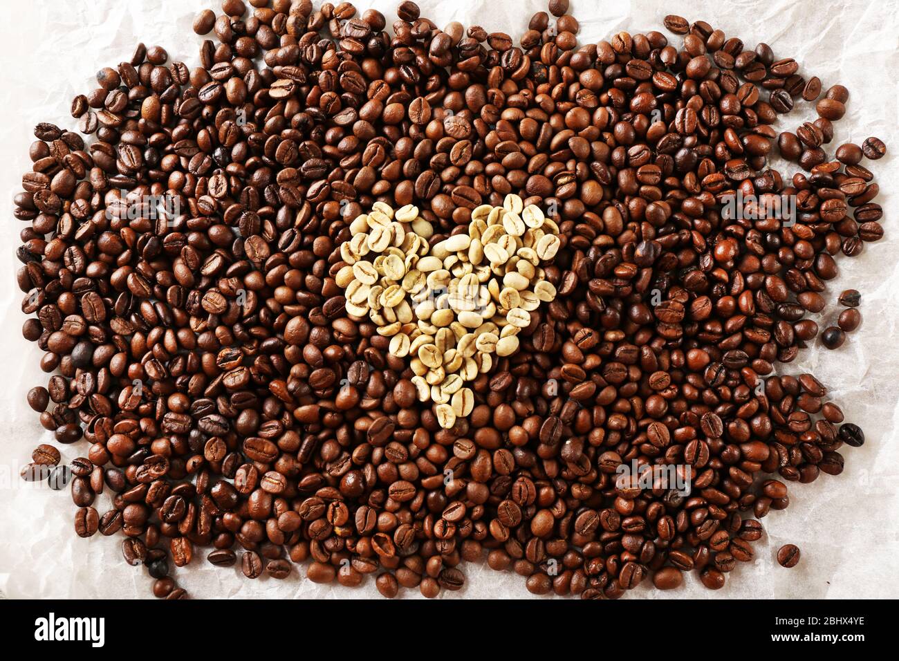 Coffee beans on crumpled parchment Stock Photo - Alamy