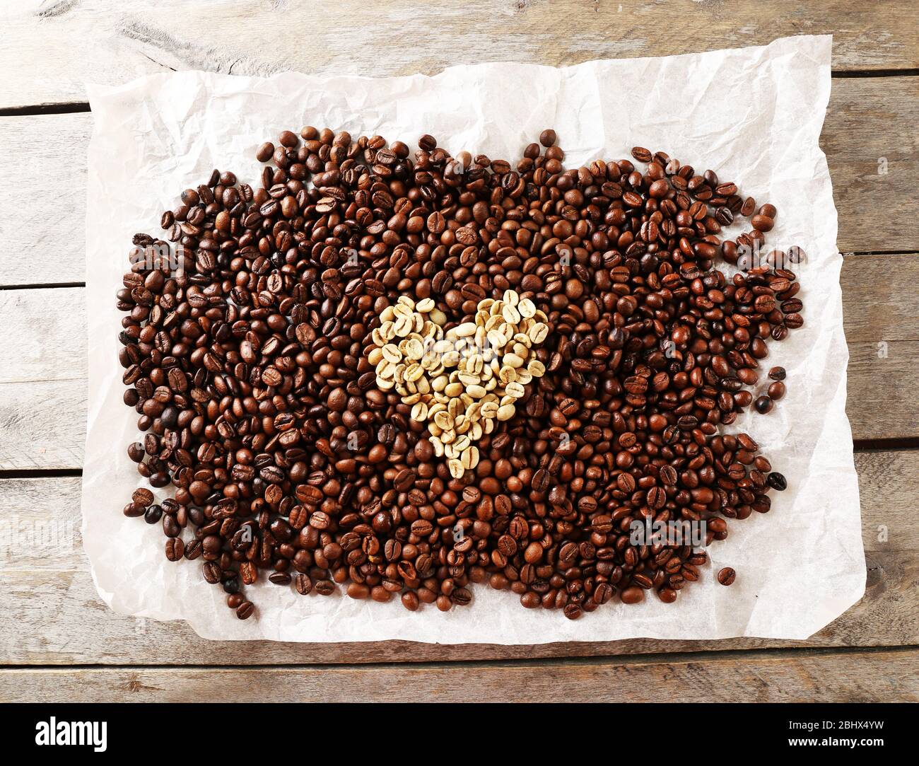 Coffee beans on crumpled parchment Stock Photo - Alamy