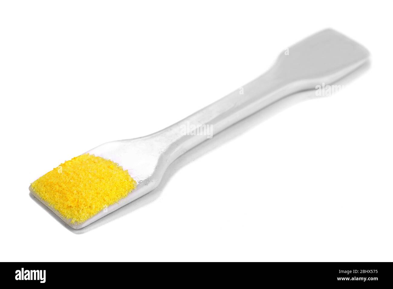 Laboratory spatula with granules isolated on white Stock Photo - Alamy