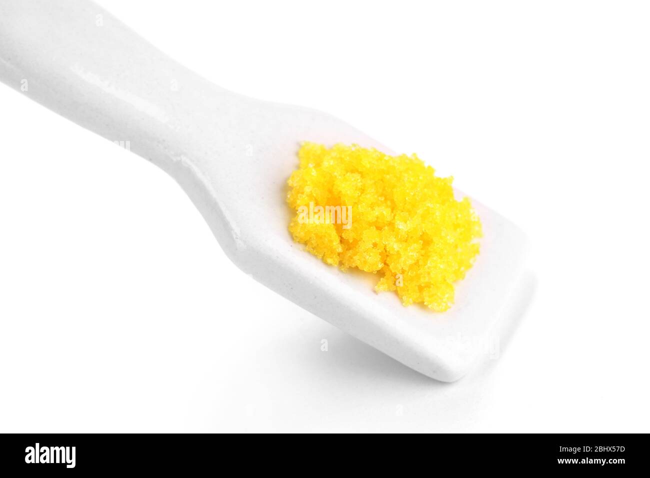 Laboratory spatula with granules isolated on white Stock Photo - Alamy
