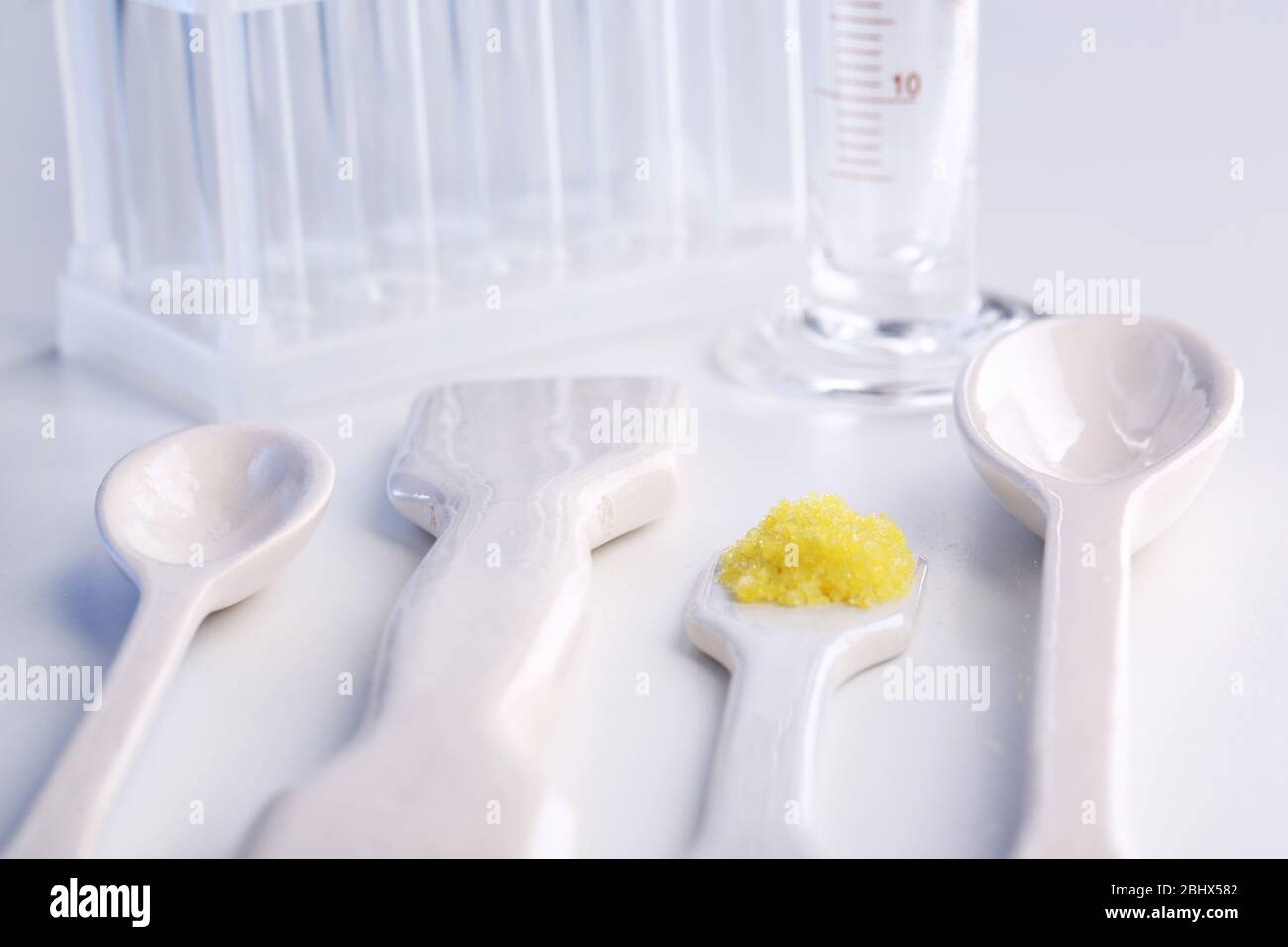 Laboratory spatulas on white table Stock Photo - Alamy