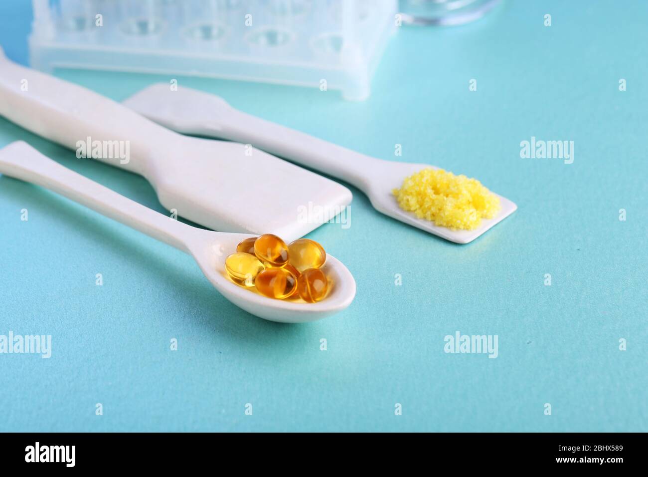 Laboratory spatulas on blue table Stock Photo - Alamy