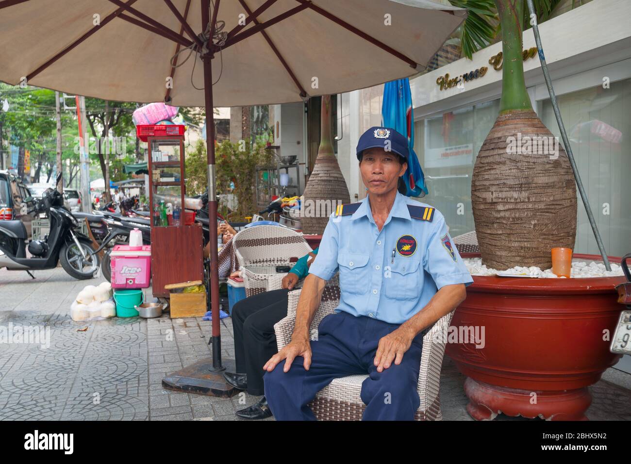 Saigon Vietnam - October 12 2013; Security guard sitting outside ...