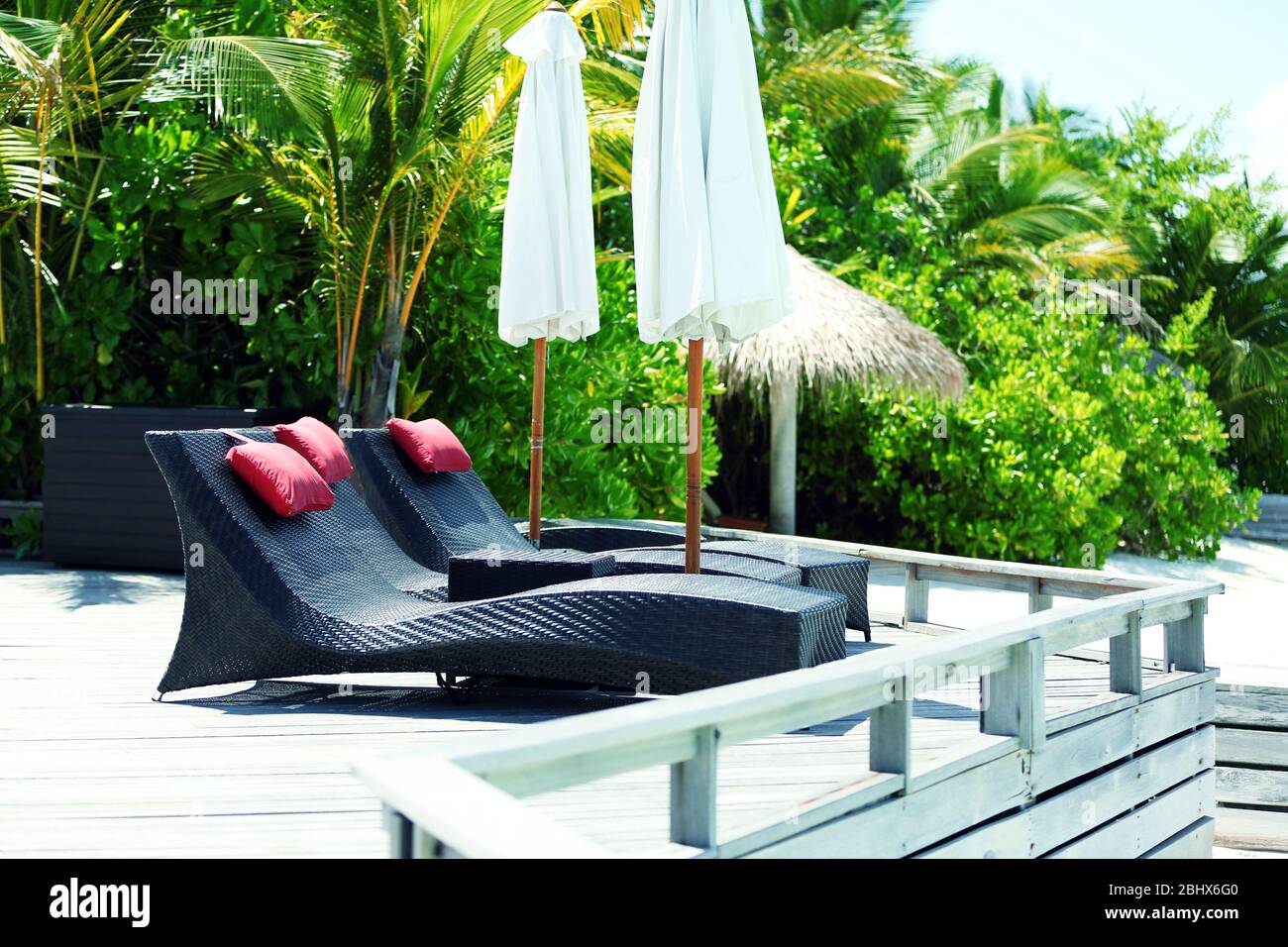 Sunbed in resort in hotel room over blue ocean in Baros Maldives Stock ...