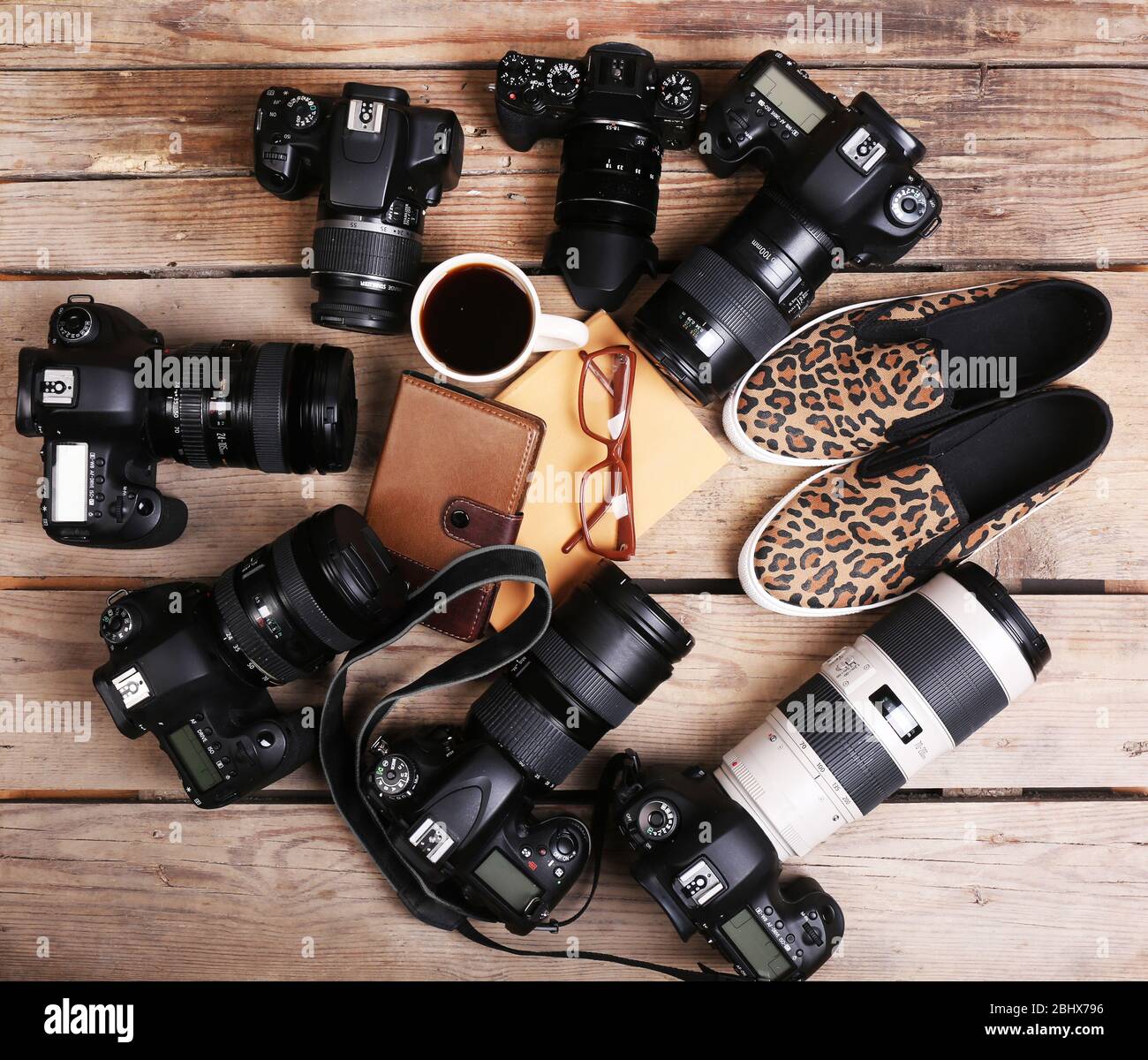 Still life with modern cameras on wooden table, top view Stock Photo ...