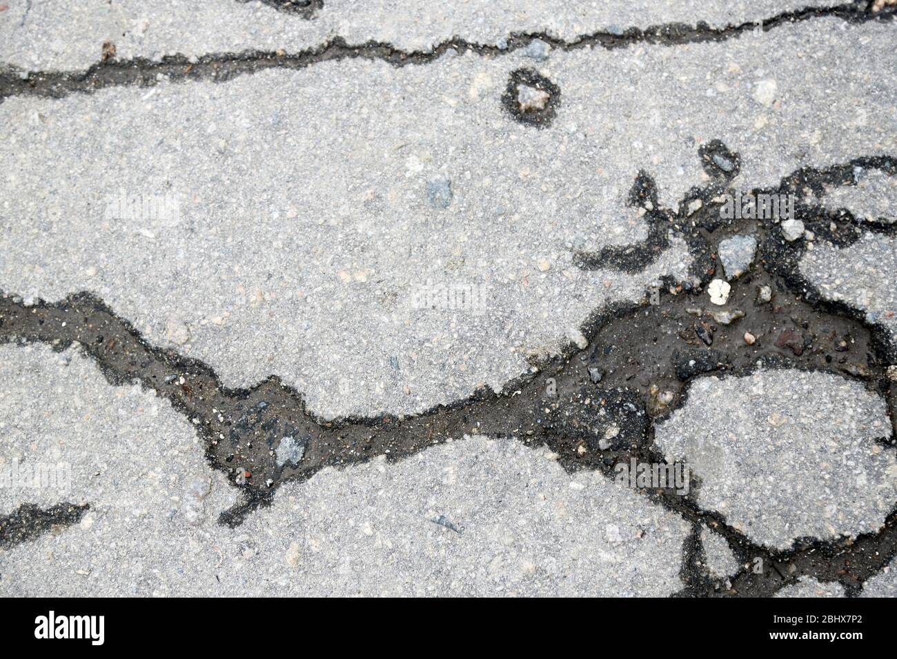Broken asphalt close up Stock Photo - Alamy