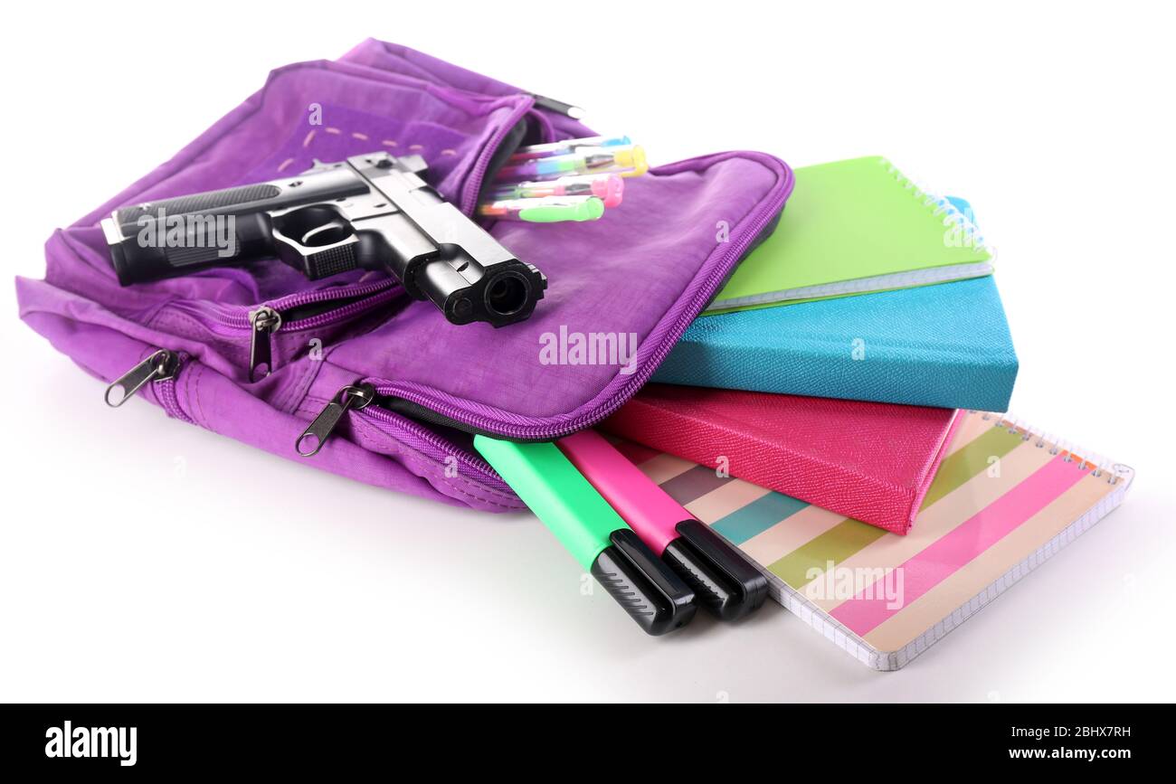 Gun in school backpack, isolated on white Stock Photo - Alamy