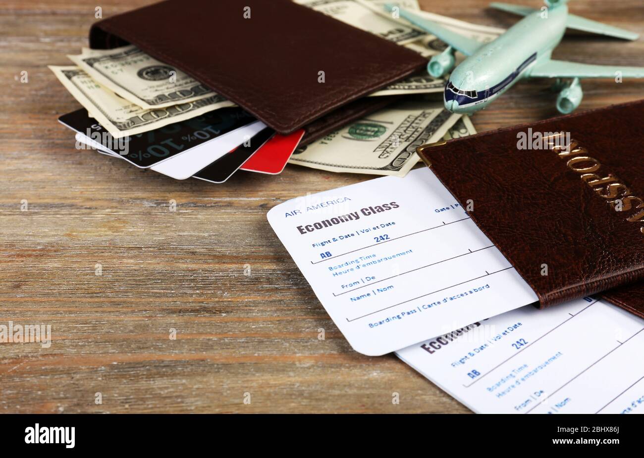 Airline tickets and documents on wooden background Stock Photo - Alamy