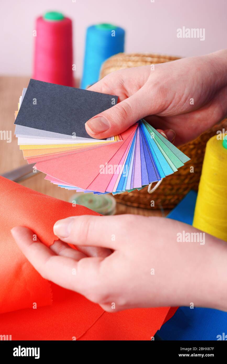 Hands with material samples hi-res stock photography and images - Alamy