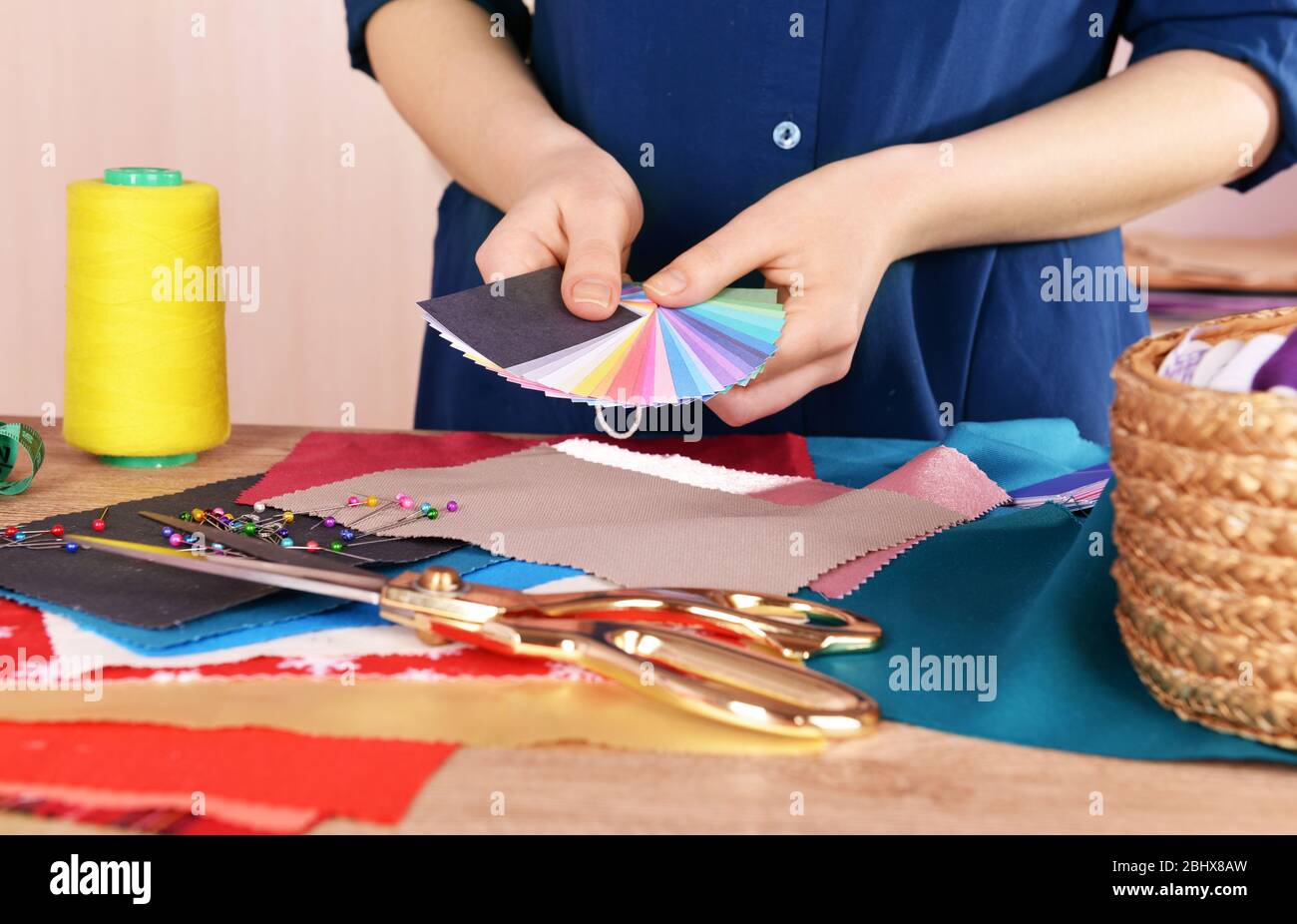 Samples of colorful fabric in female hands, closeup Stock Photo - Alamy