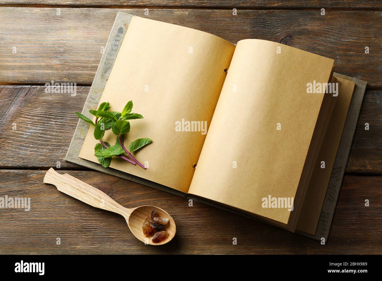 Open recipe book with mint leaves on wooden background Stock Photo - Alamy
