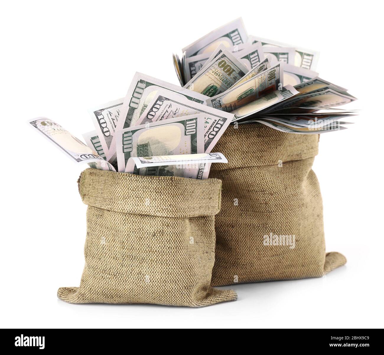 Money in bags isolated on white Stock Photo - Alamy