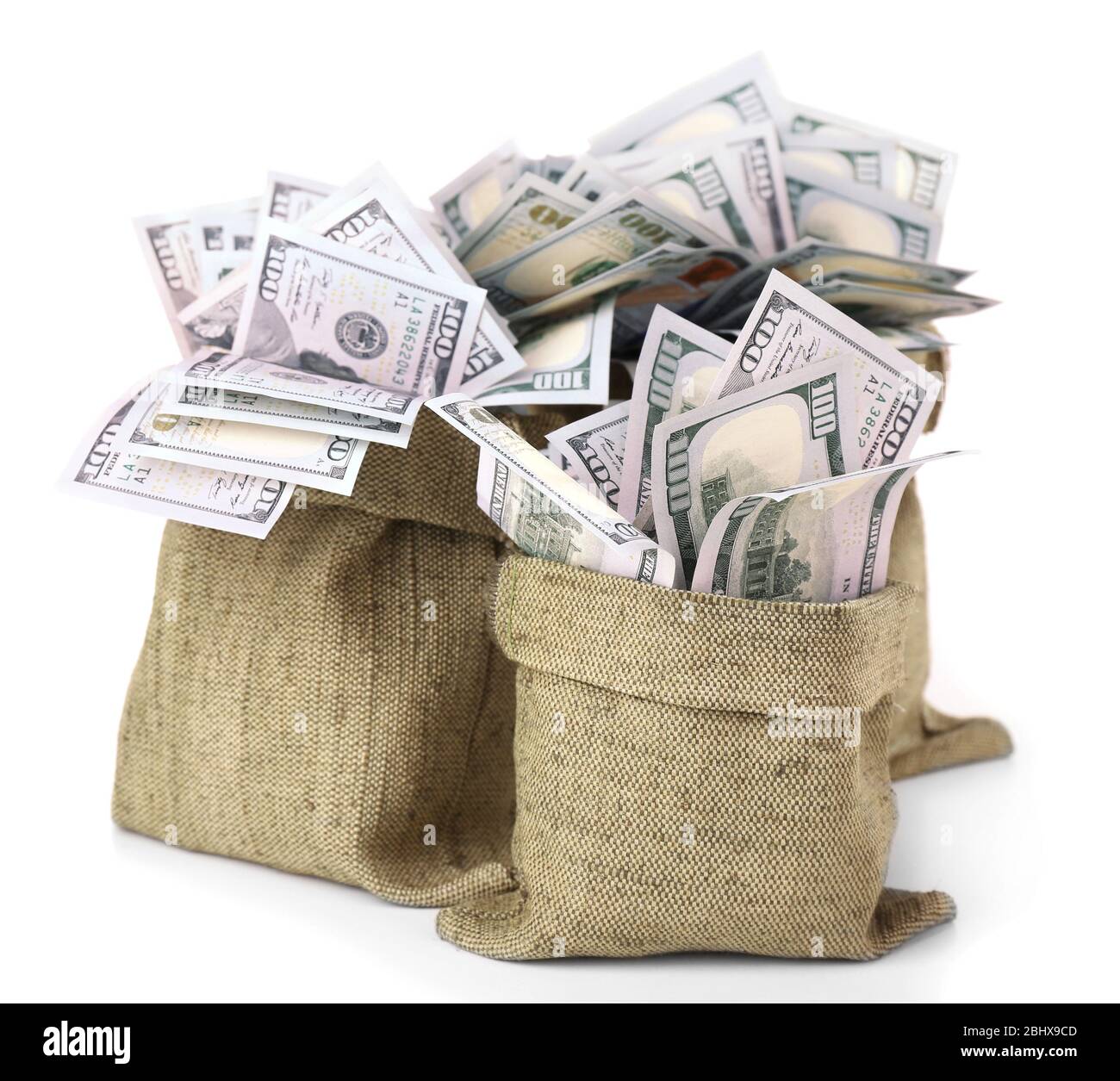 Money in bags isolated on white Stock Photo - Alamy
