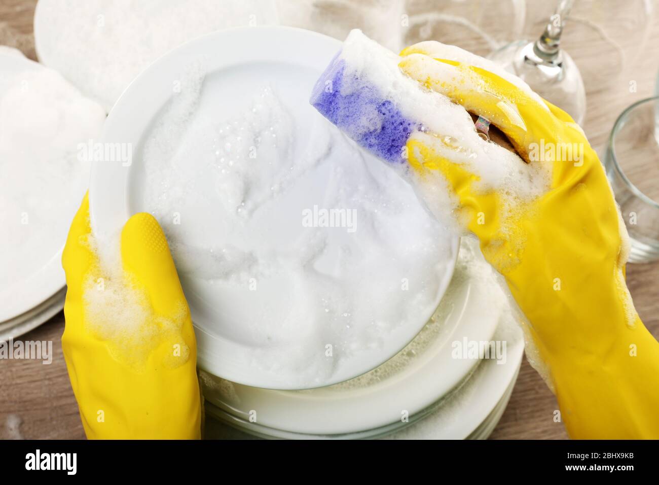 Female hand washing dish close up Stock Photo - Alamy