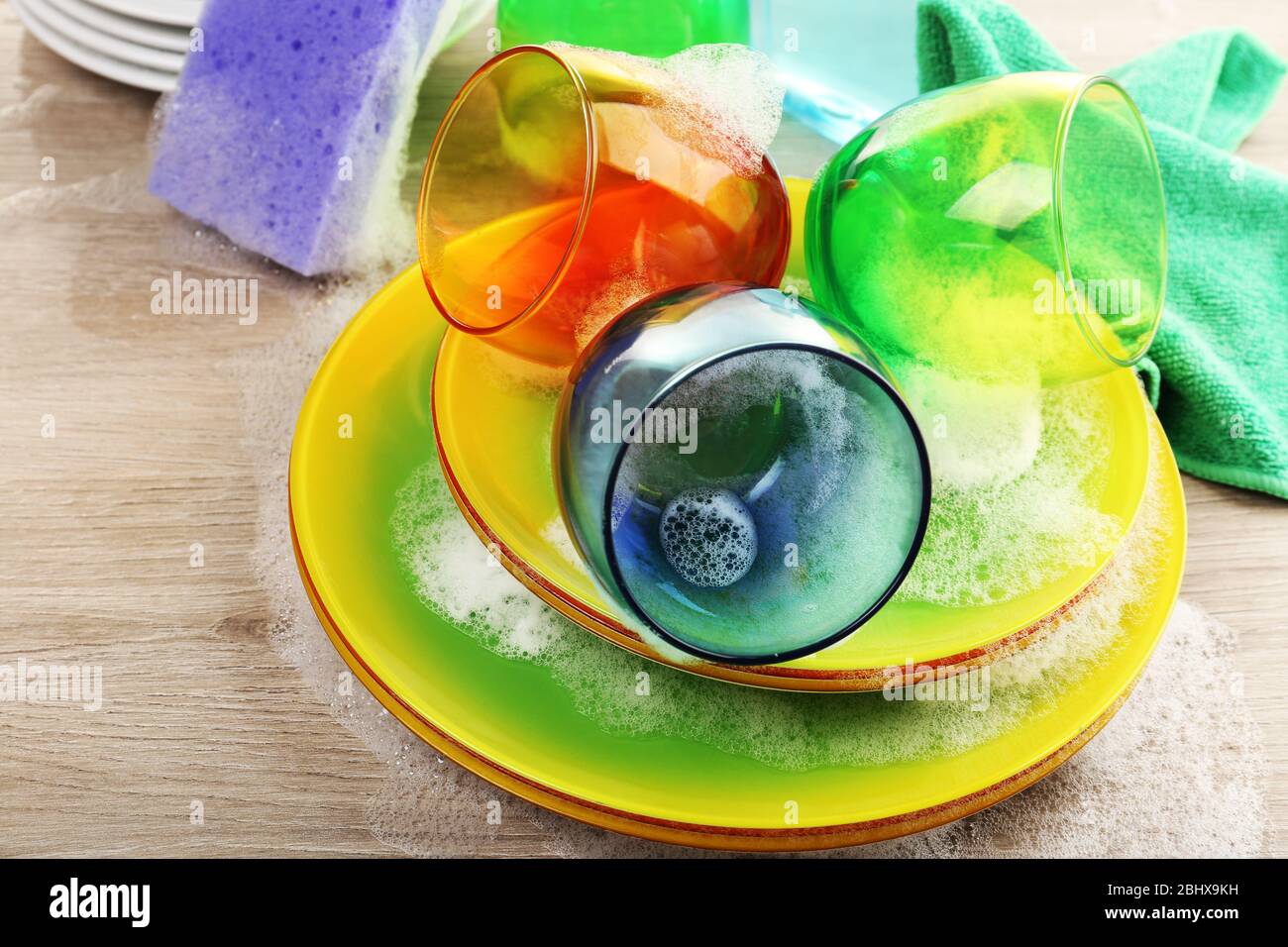 Dishes in foam on table close up Stock Photo - Alamy