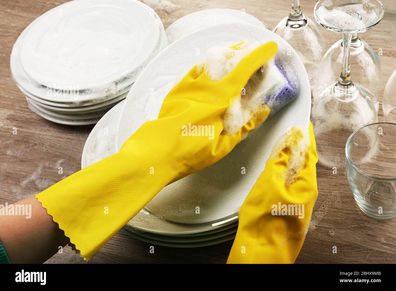 Female hand washing dish close up Stock Photo - Alamy