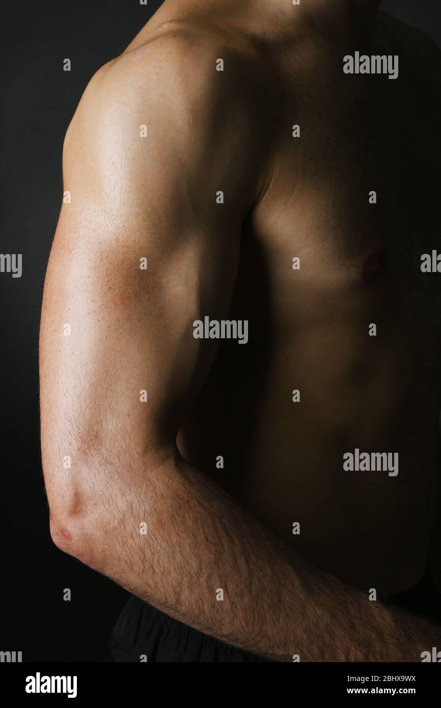 Muscle young man close up Stock Photo - Alamy