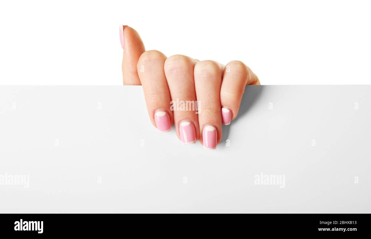 Female hand holding paper blank isolated on white Stock Photo - Alamy
