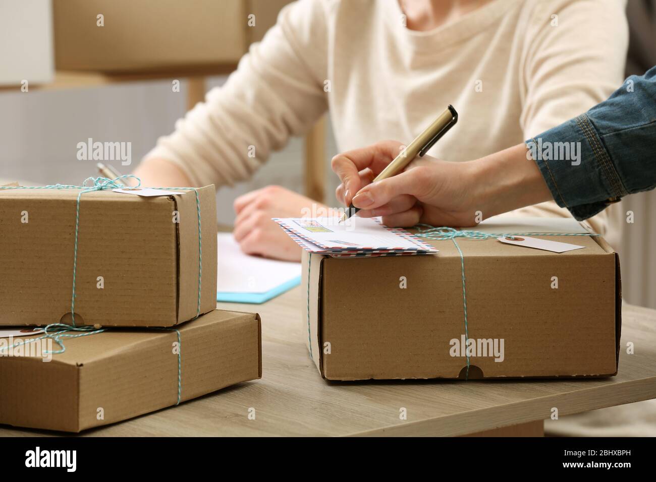 Women signs parcels in post office Stock Photo - Alamy