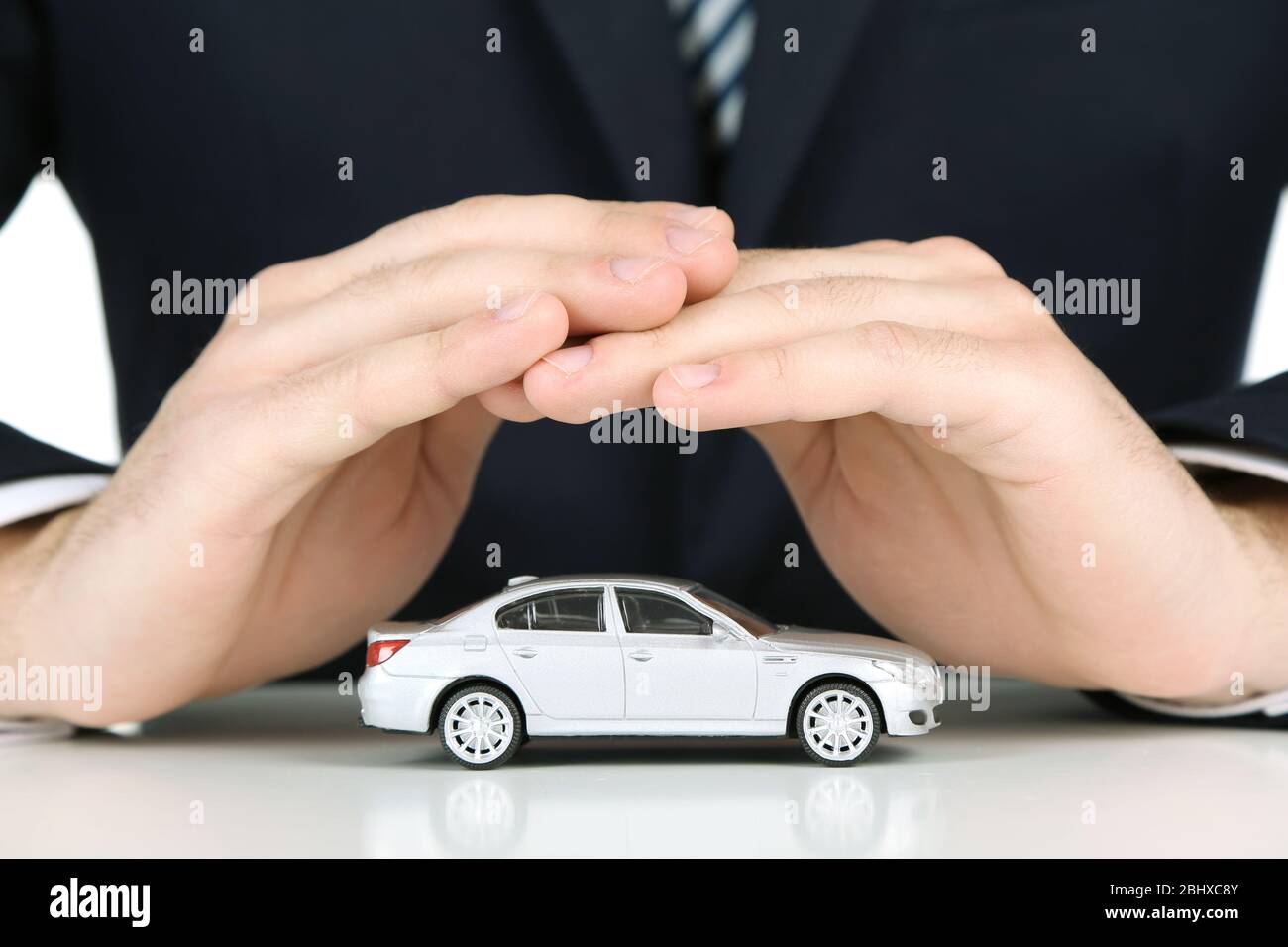 Man holding model of car in his hands, closeup Stock Photo - Alamy