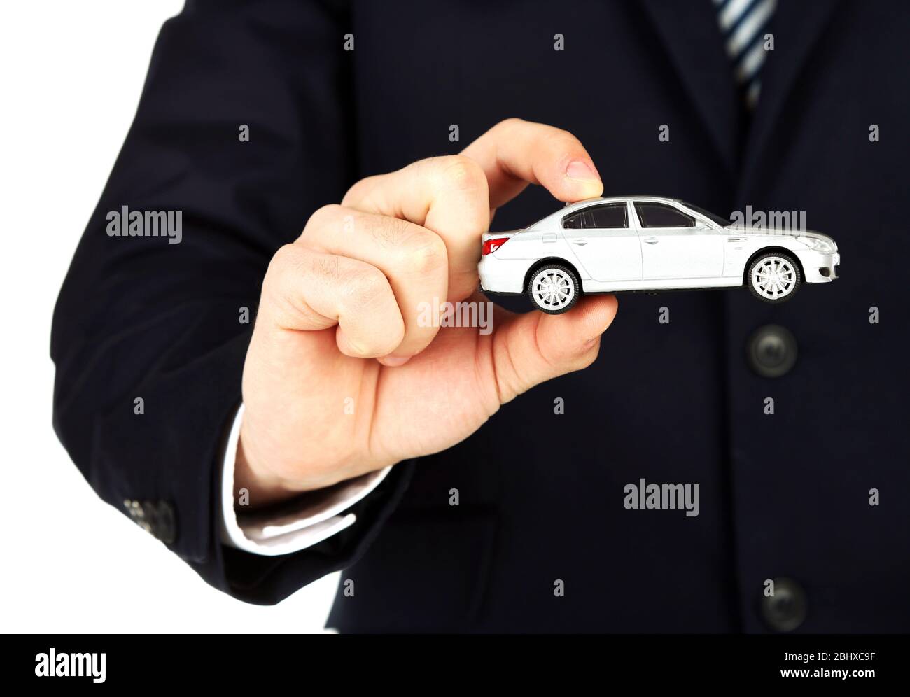 Man holding model of car in his hand Stock Photo - Alamy