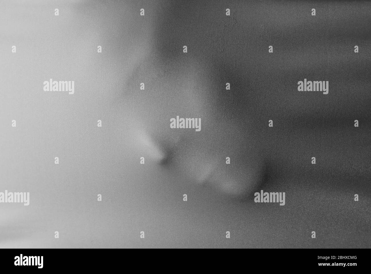 Human face pressing through fabric as horror background Stock Photo - Alamy