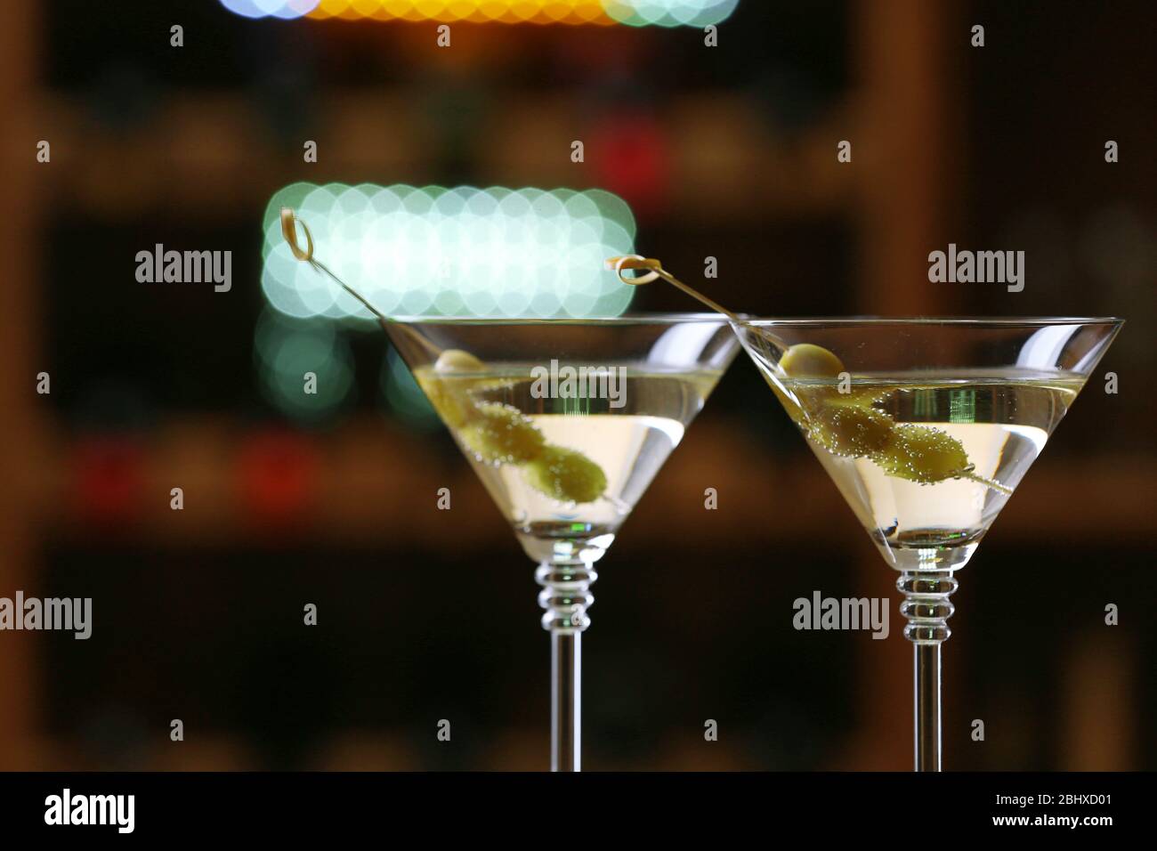 Glasses of cocktails on bar background Stock Photo - Alamy